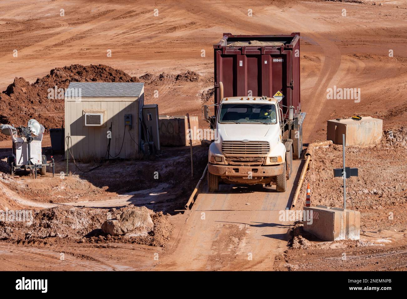 A container truck loaded with hazardous waste pulls through the weigh ...