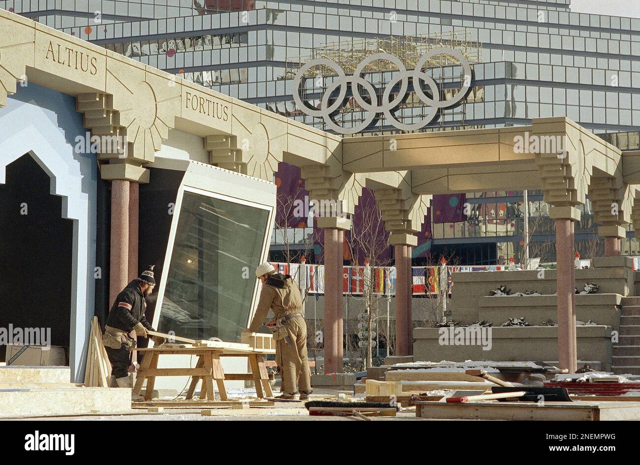 Workers prepare the site in downtown Calgary on Monday, Feb. 1, 1988 ...