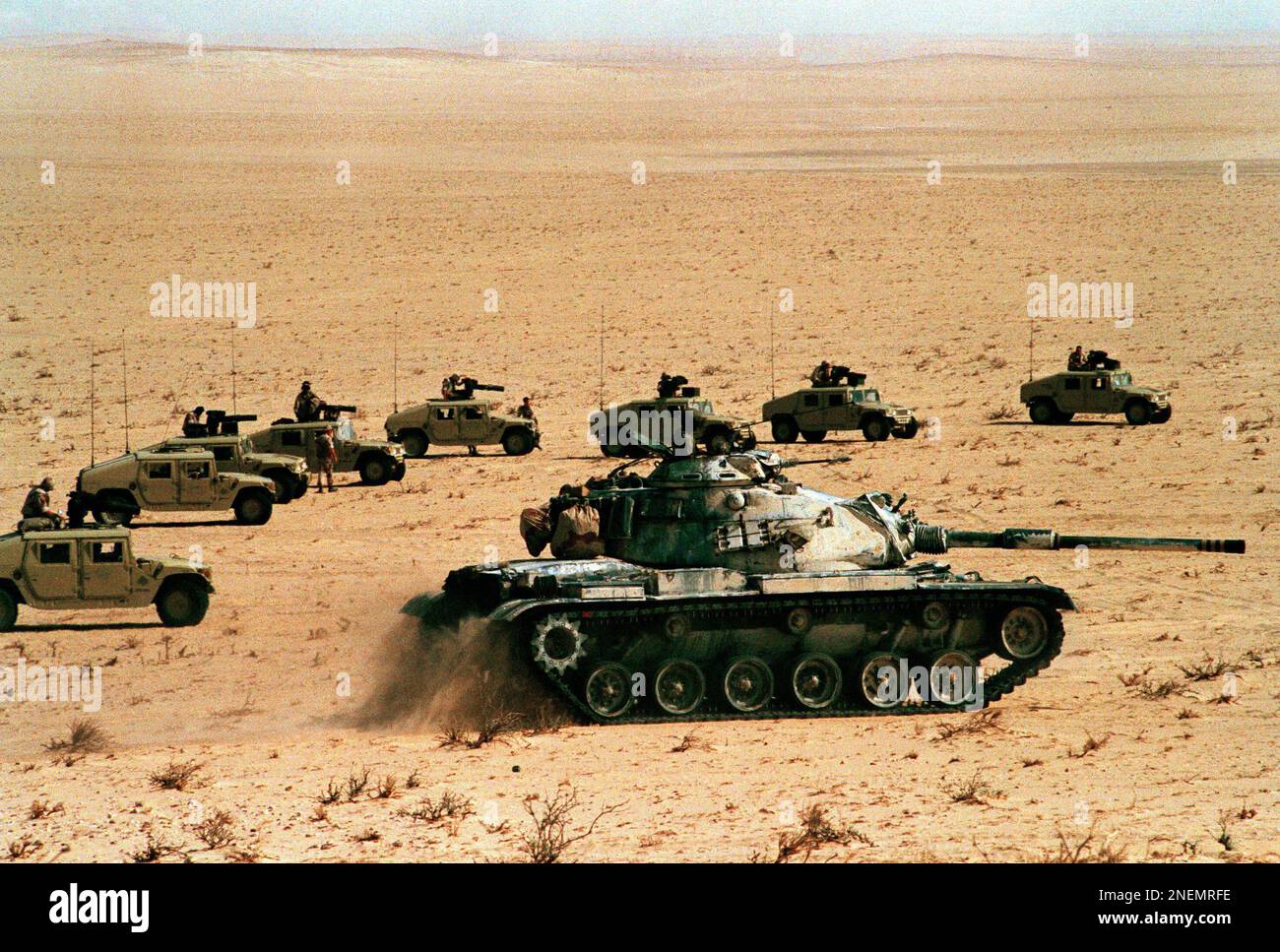 A Marine M-60 tank leads an assault of Humvee?s mounted with Tow anti ...