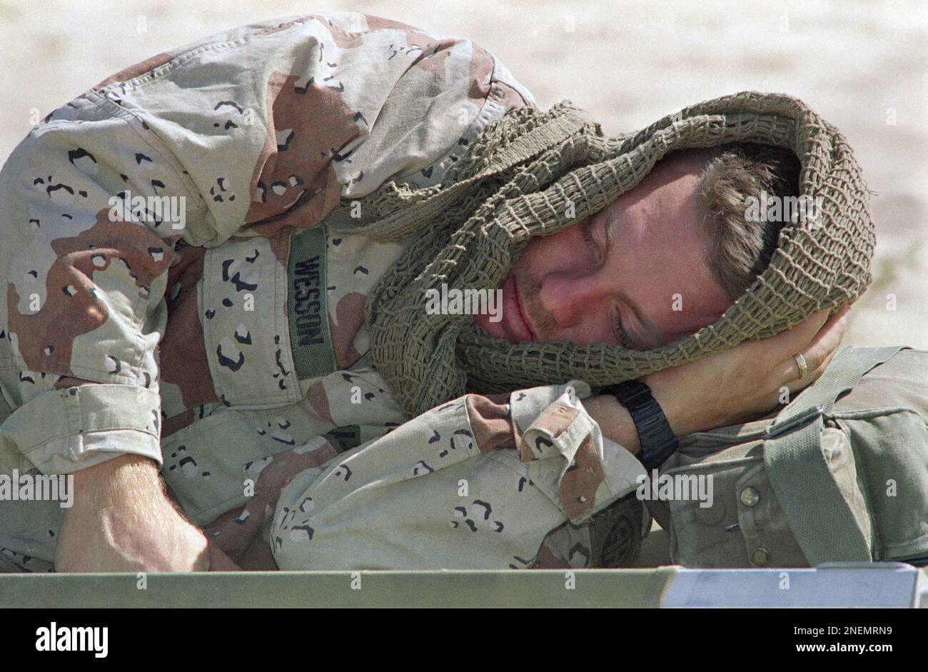 U.S. Army SPC Rick Wesson of Modesto, Calif., catches a nap atop his ...