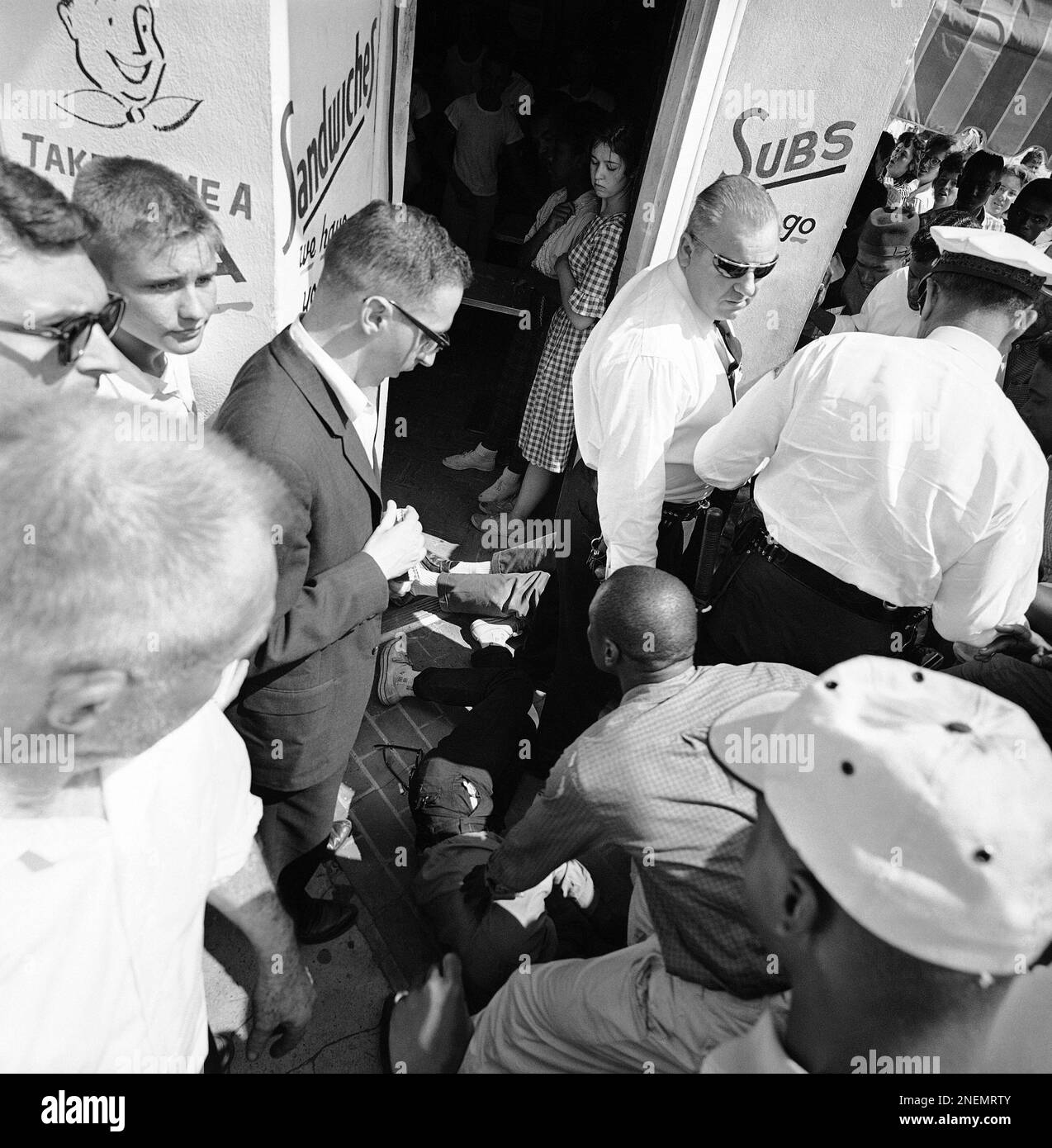 Integrationists aid several demonstrators in a group of six who entered ...