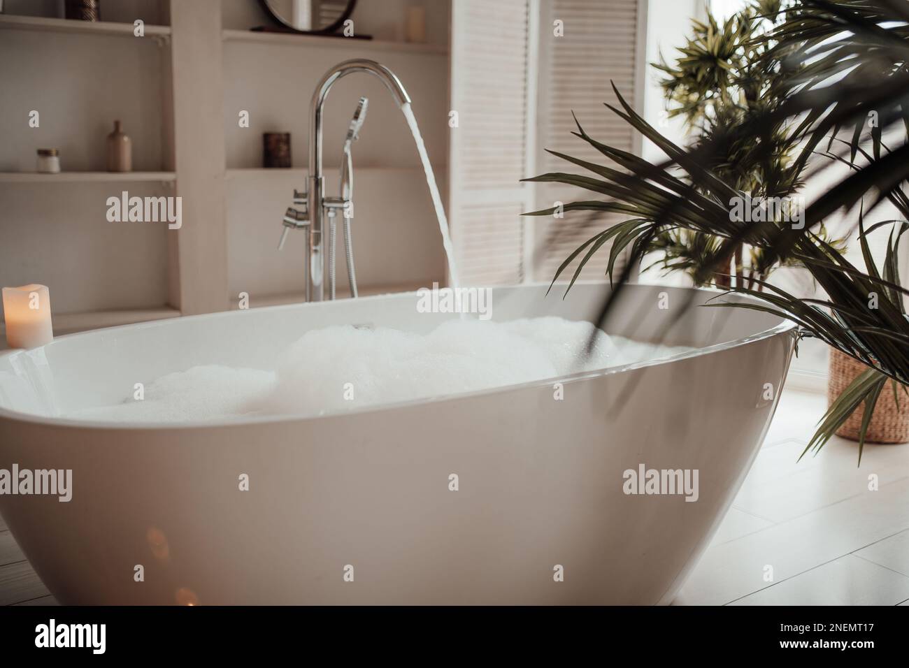 Soft native hues organic shapes look of bathroom with big window oval ...