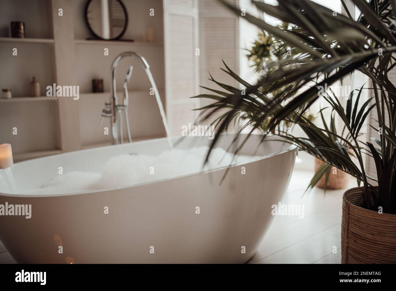 Soft native hues organic shapes look of bathroom with big window oval ...