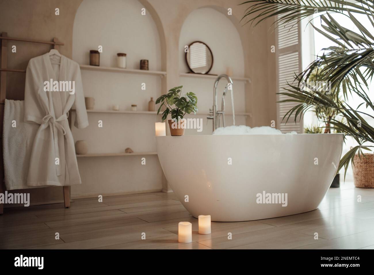 Soft native hues organic shapes look of bathroom with big window oval ...