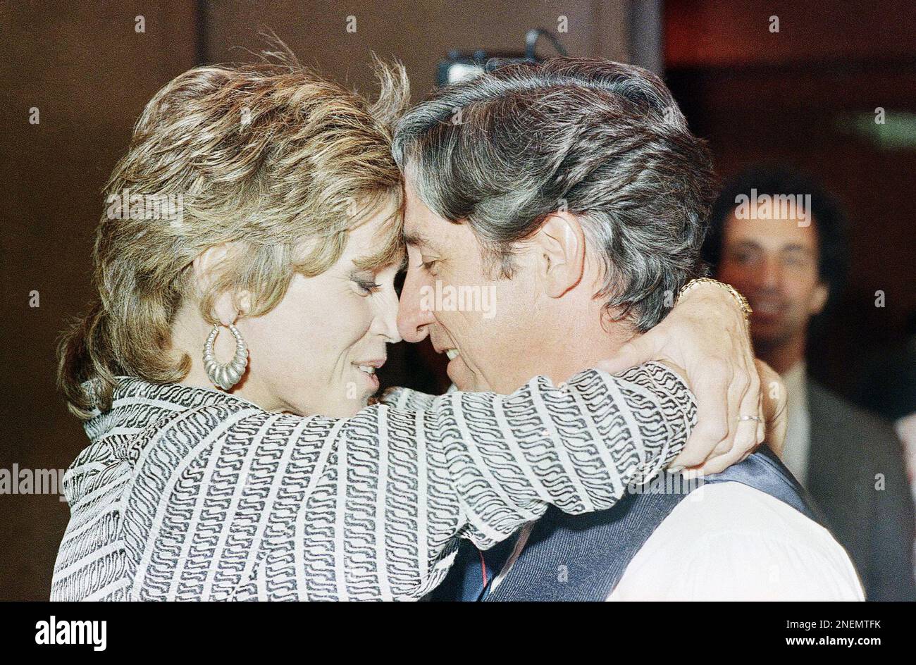 Actress Jane Fonda, left, gives her husband Tom Hayden a nose-to-nose ...