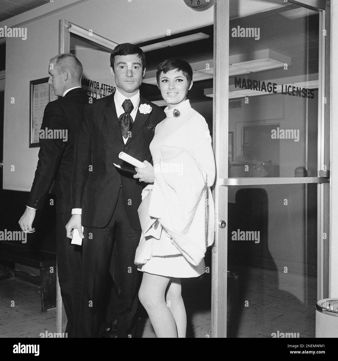 Vidal Sassoon and new wife Beverly Adams, holding marriage license, are ...