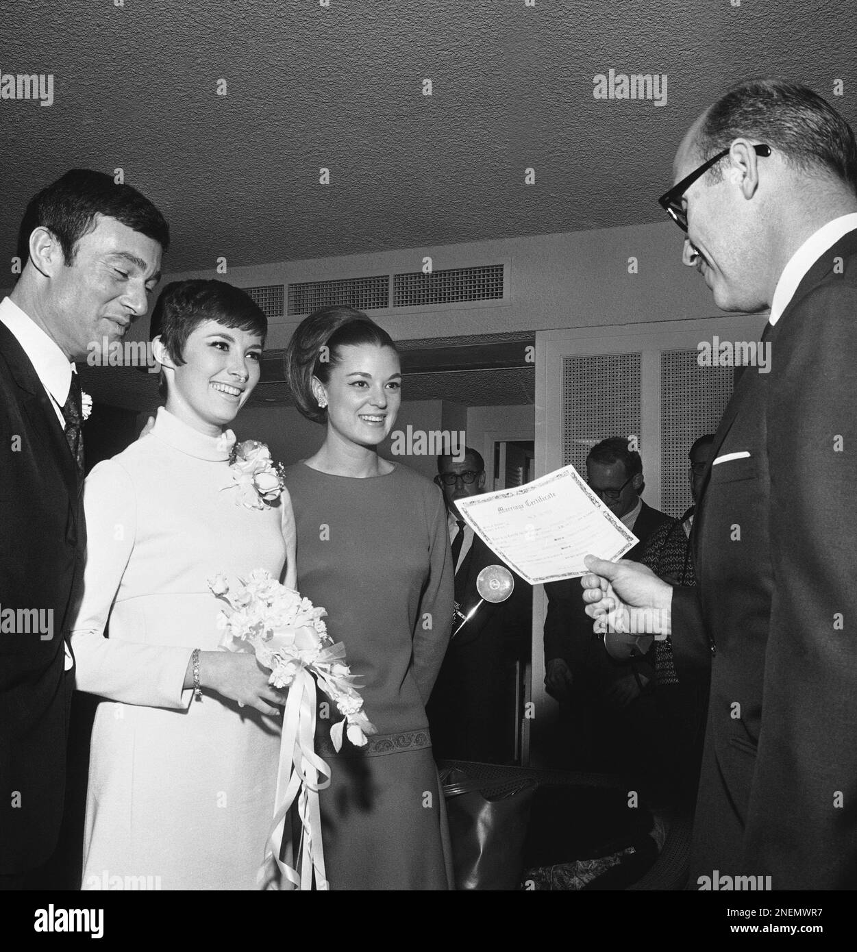 Justice of the Peace Herman Fisher begins the wedding ceremony of Vidal ...