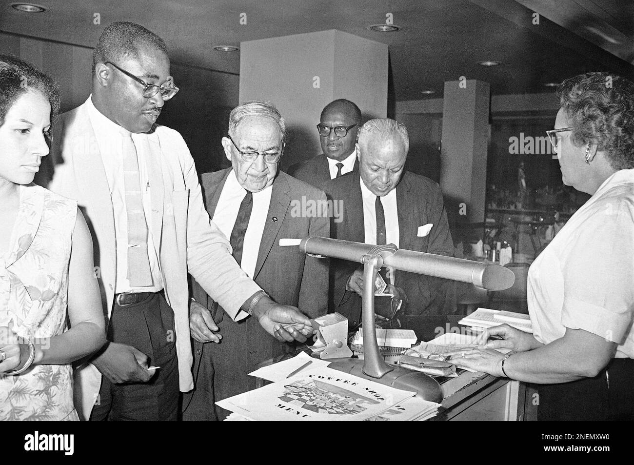 While Kenneth Guscott, president of the Boston NAACP chapter reaches ...