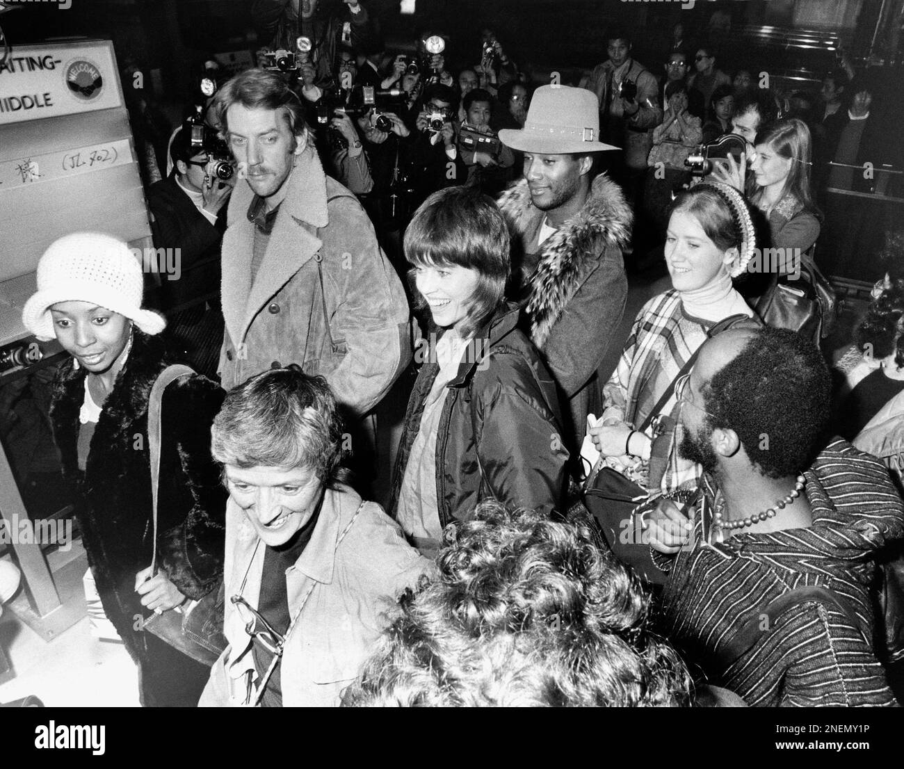 American actress Jane Fonda, second from right, 33, and her group hold ...