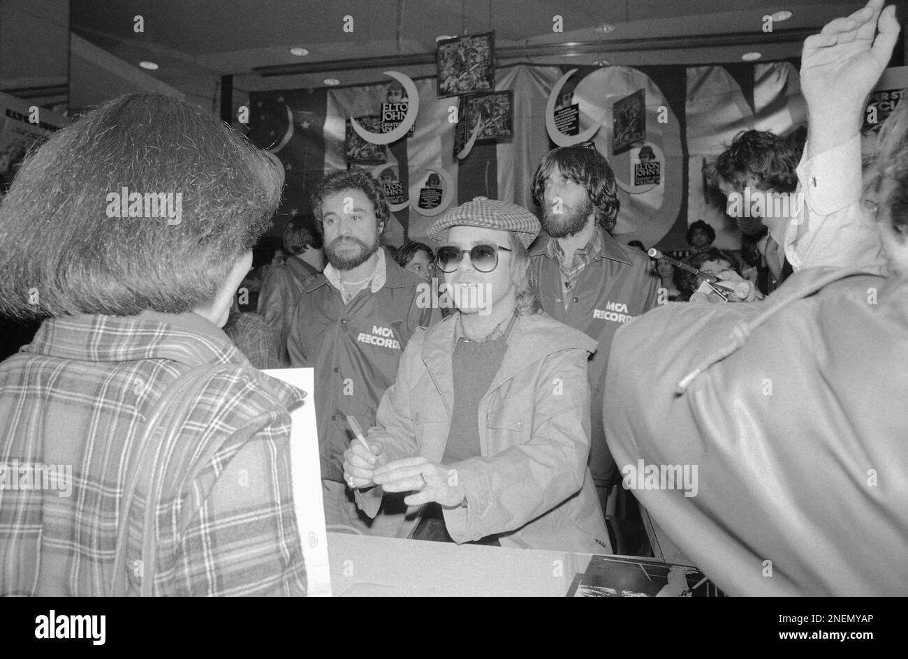 Elton John autographs records at Sam Goody record store at 51st and ...