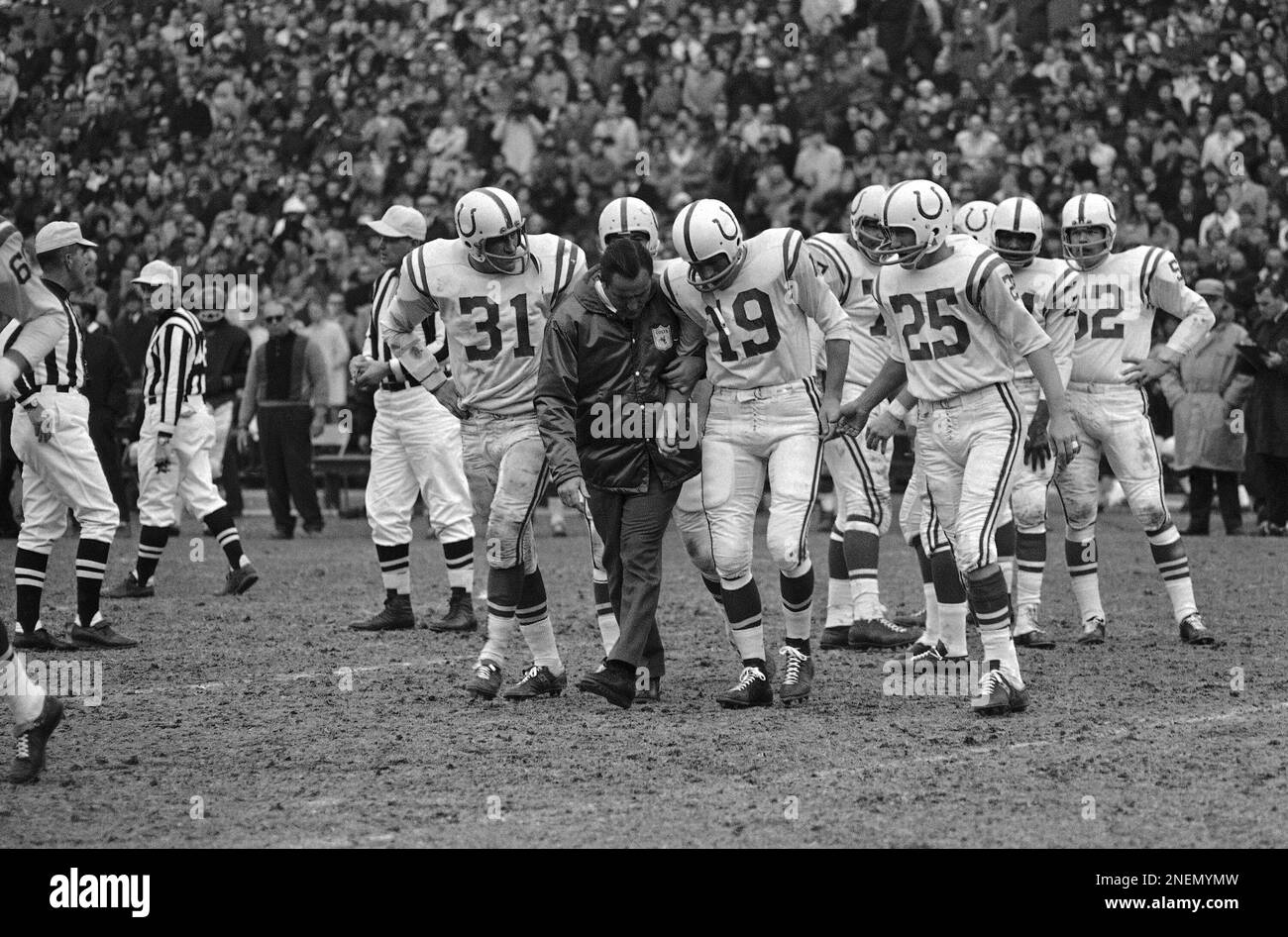 Coach Don Shula and anxious teammates crowd around injured quarterback ...