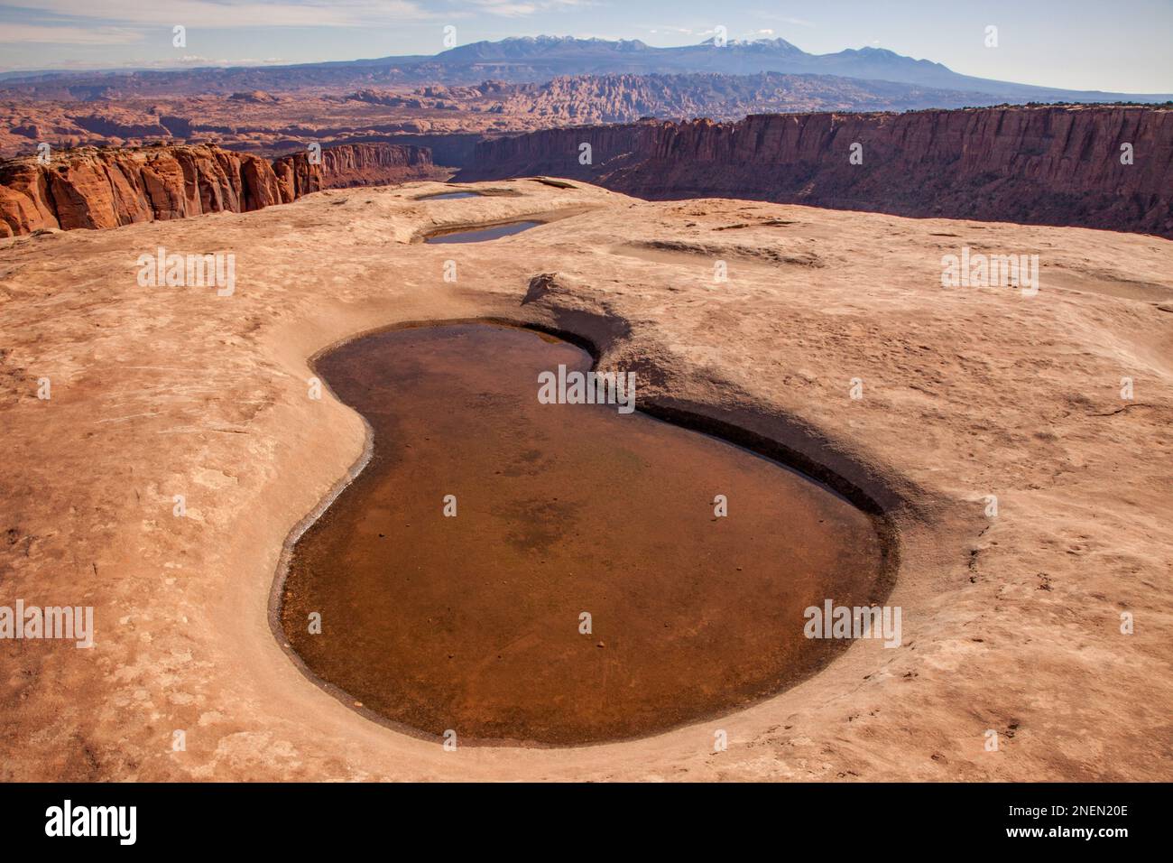 Rainwater-filled ephemeral pools in the Kayenta sandstone at Pucker ...