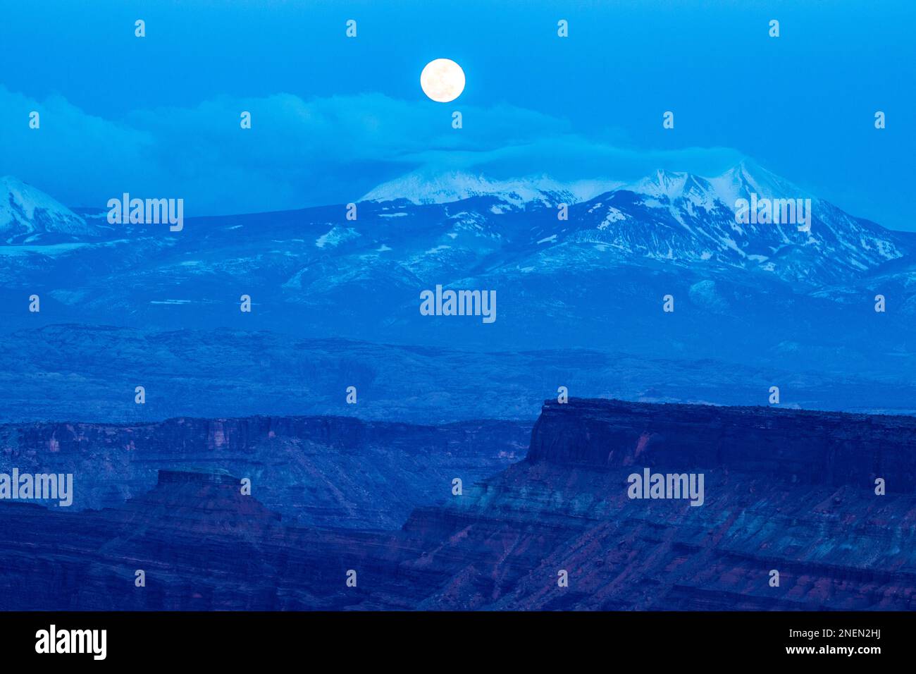Full moon over snow capped hi-res stock photography and images - Alamy