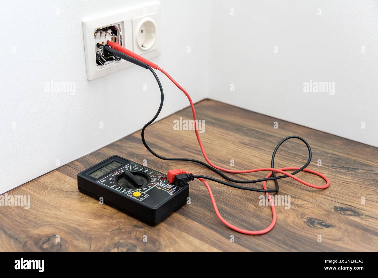 the multimeter is on the table. measuring voltage with a tester Stock ...