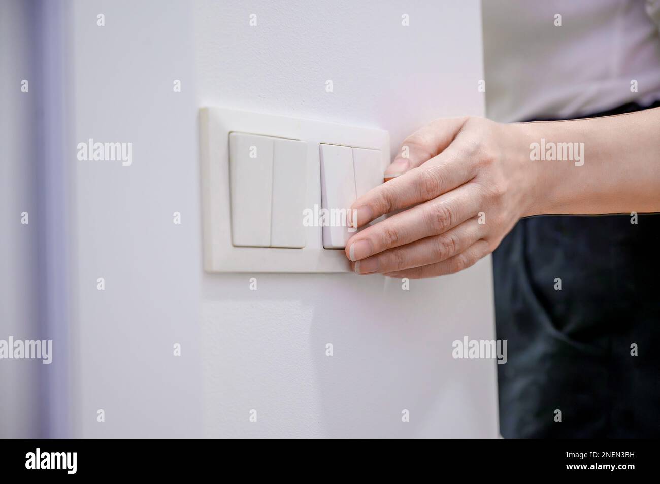 Man turns off light leaves hi-res stock photography and images - Alamy