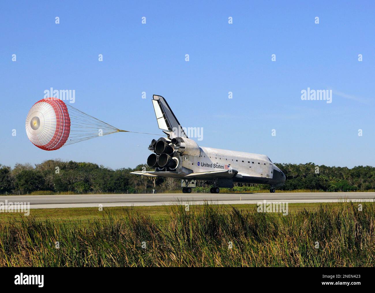 In this pool image, the space shuttle Atlantis rolls out on Kennedy ...