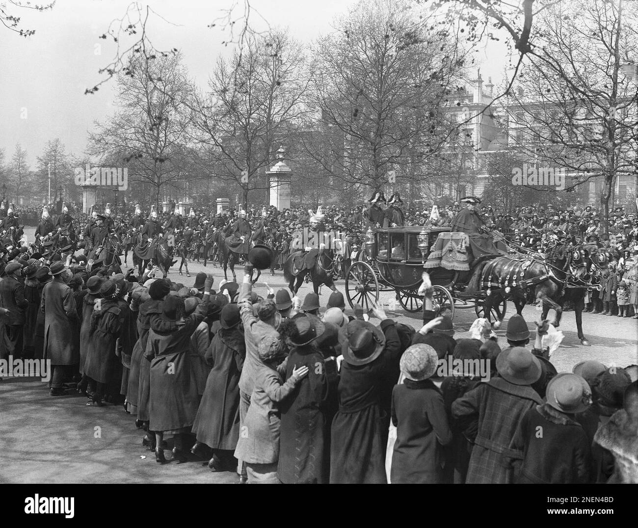 Britain's Duke of York and his bride pass crowds of cheering people as ...