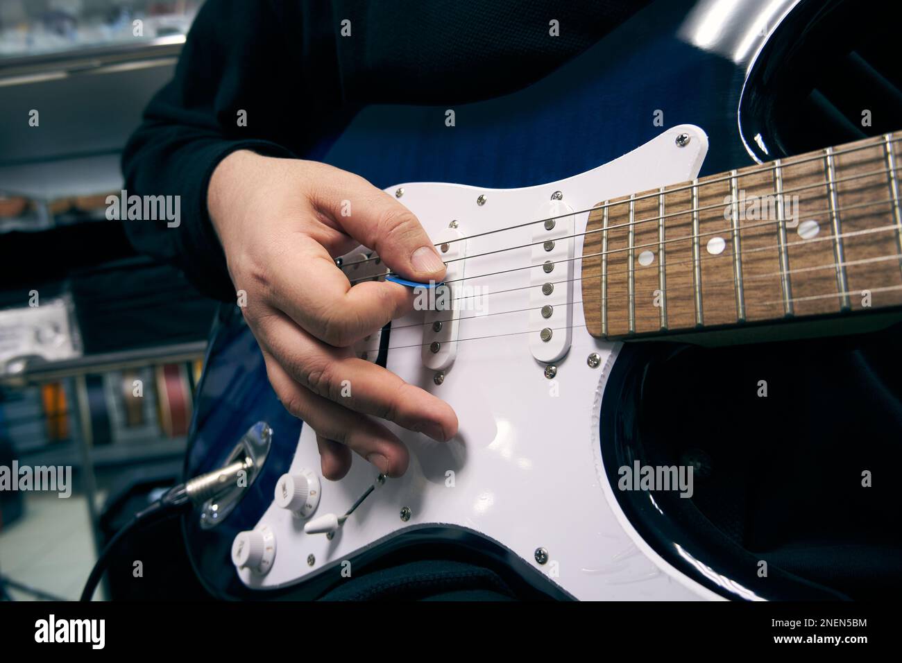Mans hand guitar hi-res stock photography and images - Alamy
