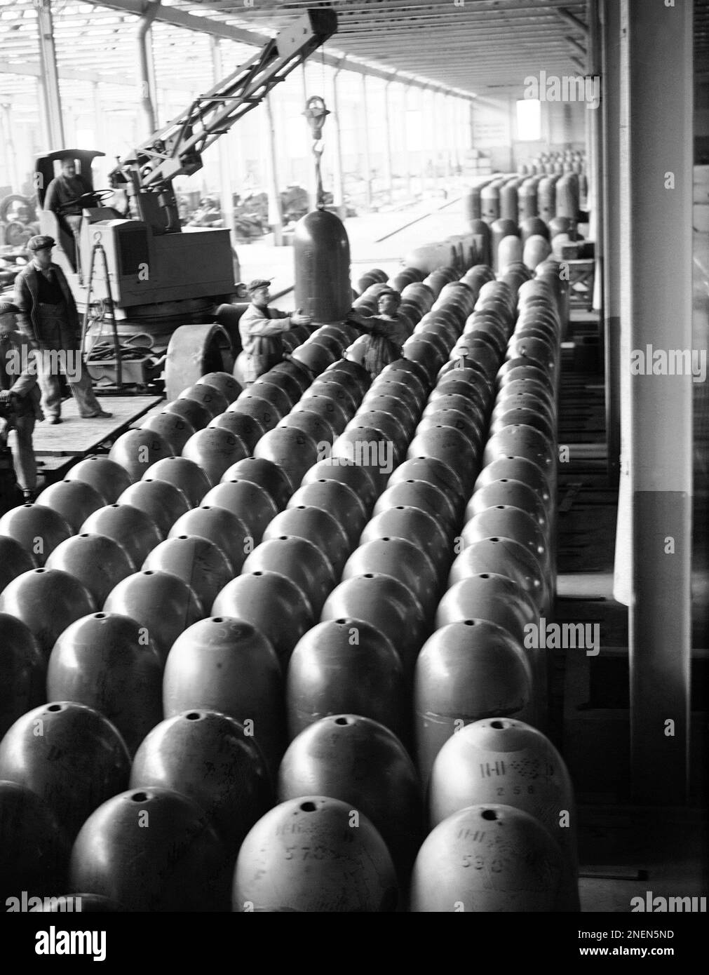 A mass of torpedo heads ready for fitting at a Royal Naval torpedo ...