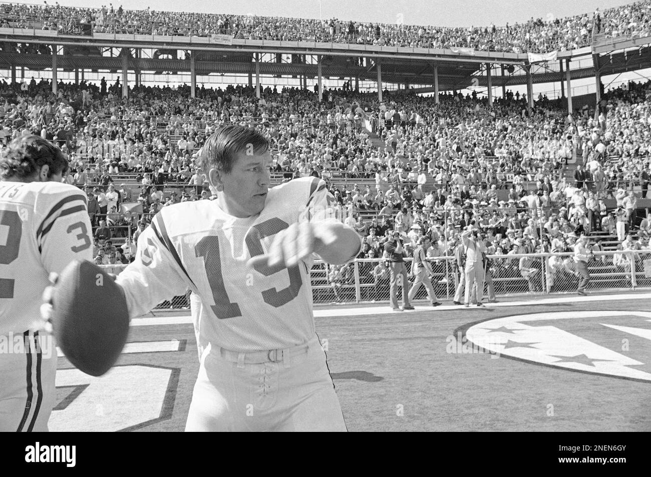Baltimore Colts quarterback John Unitas loosens his throwing arm before ...