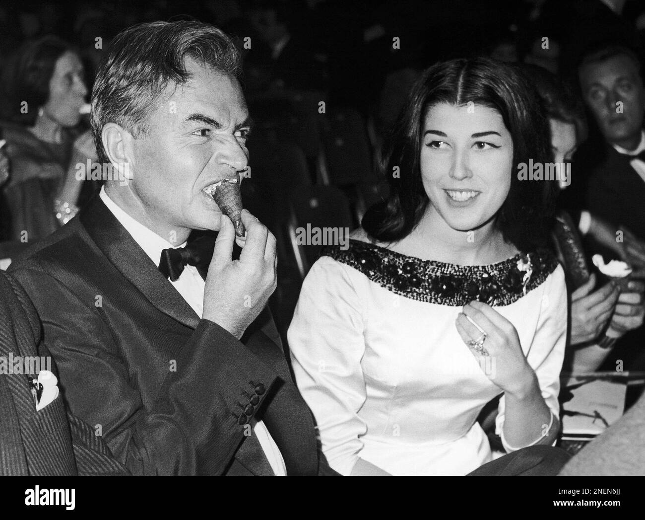 British actor James Mason eats an ice-cream cone as he and Italian ...