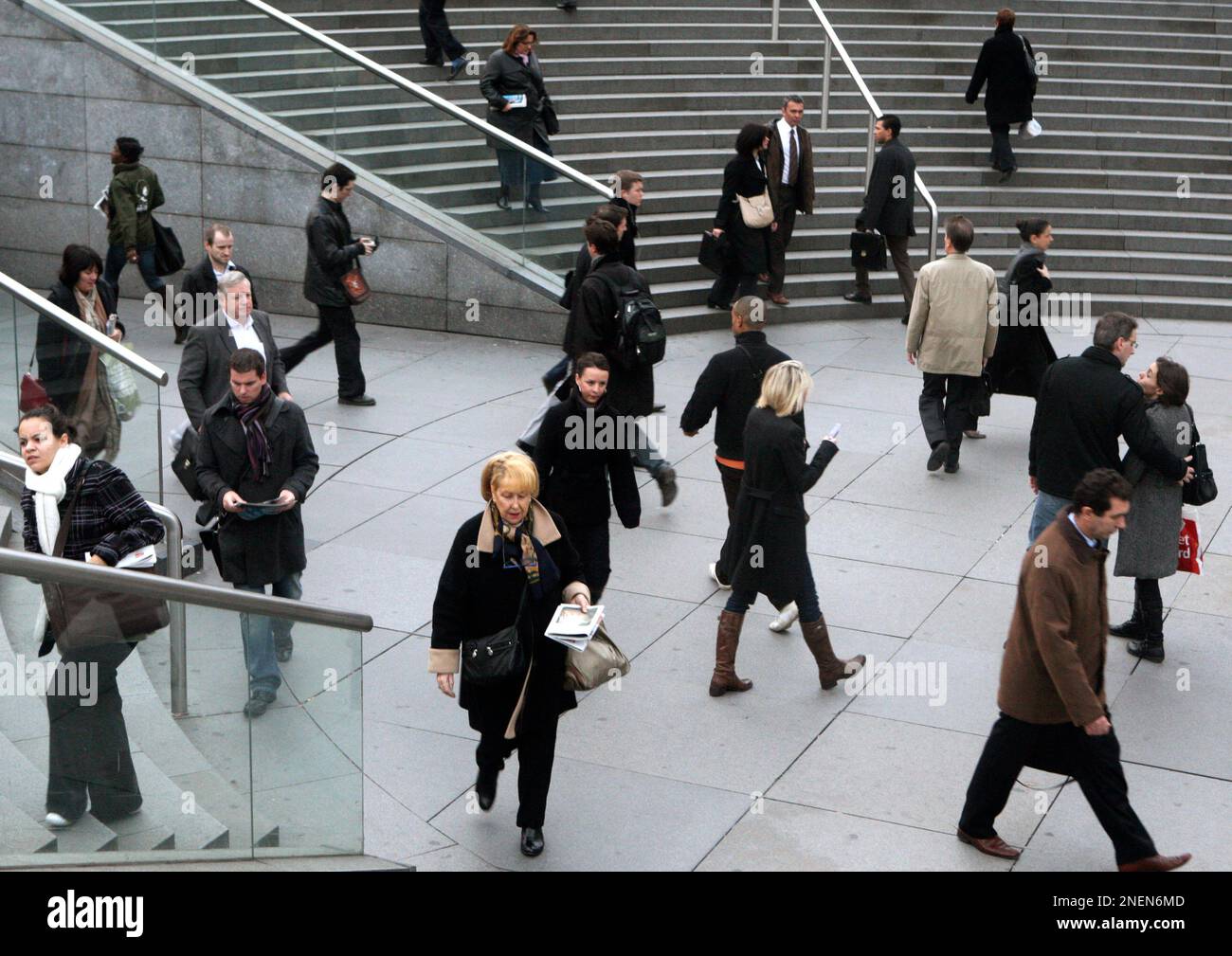 People walk in Paris suburb La Defense Wednesday Nov.25, 2009. The ...