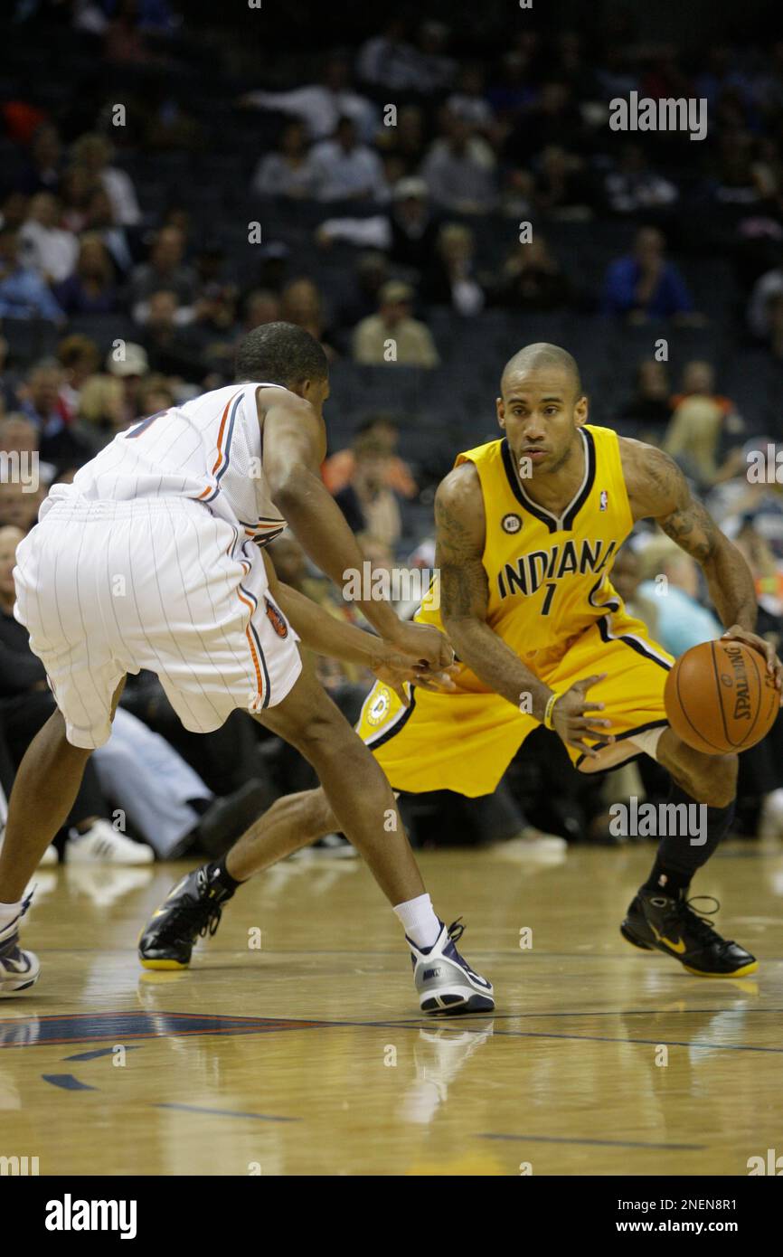 Indiana Pacers guard Dahntay Jones dribbles around a Charlotte Bobcats ...