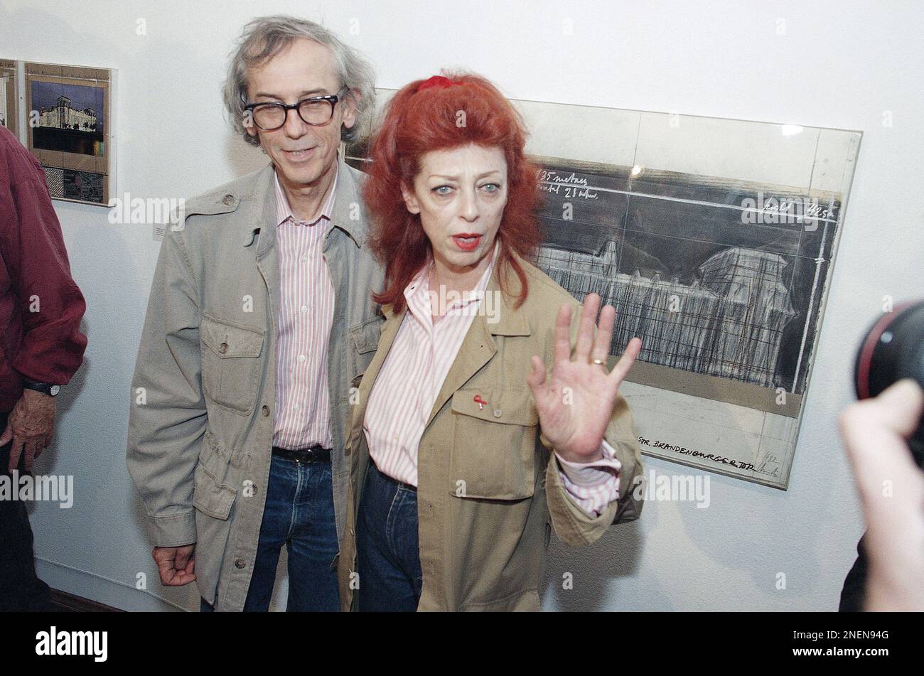 Christo, left, and his wife Jeanne-Claude pose in front of a drawing of ...