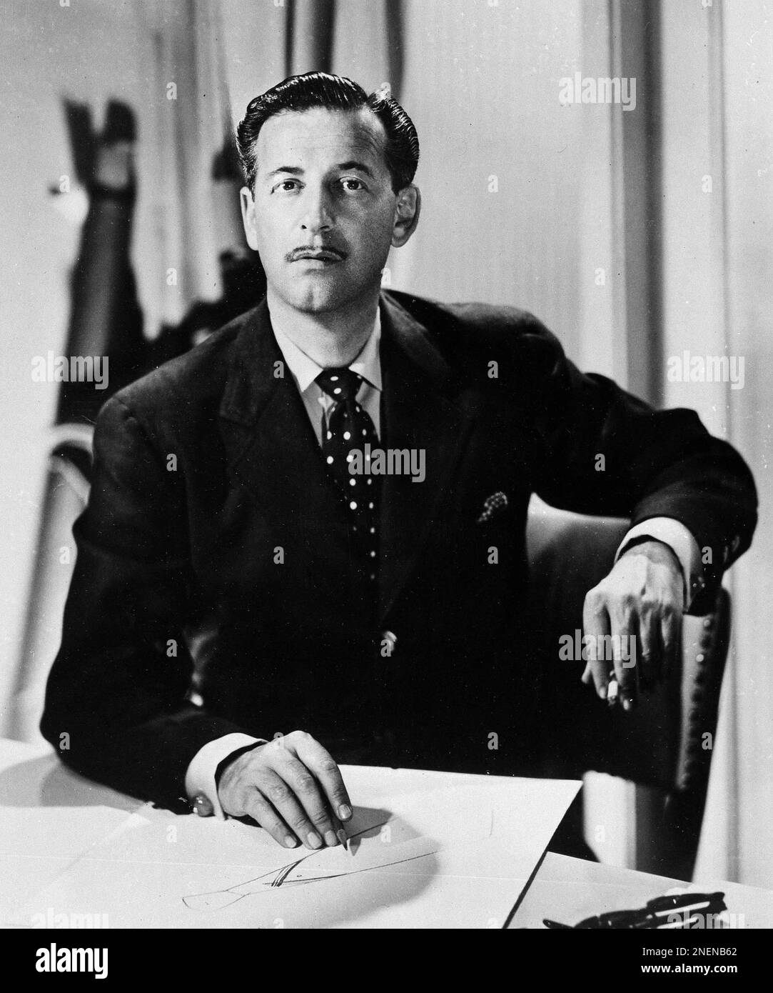 Costume designer for films, Gilbert Adrian is shown, 1951. (AP Photo ...