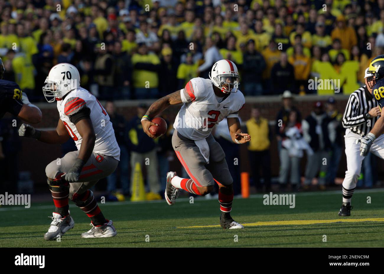 Ohio State quarterback Terrelle Pryor (2) follows the block of Bryant ...