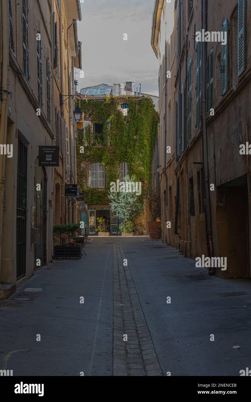 Aux-in-Provence street scene with vines on the building Stock Photo - Alamy