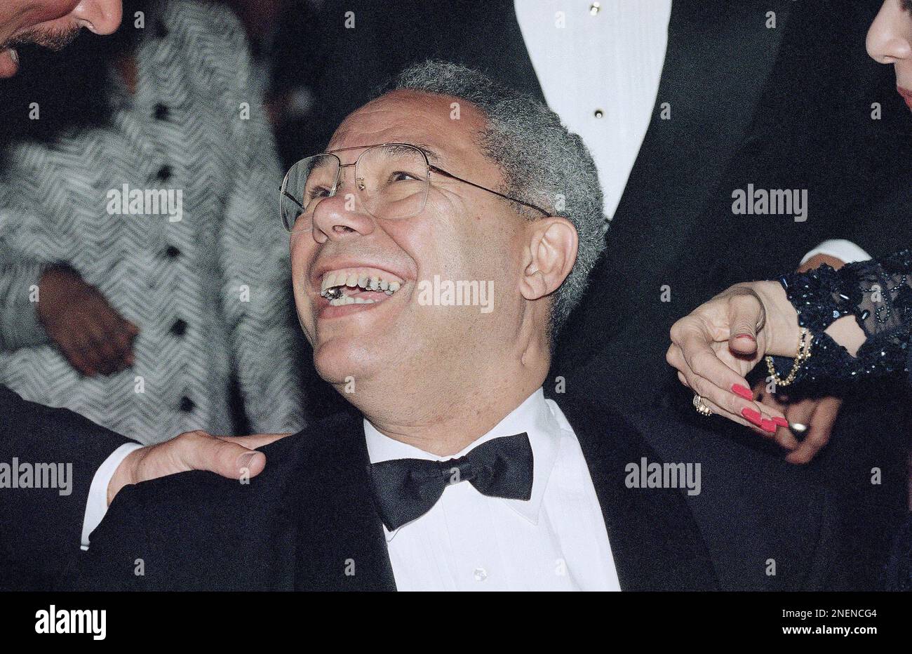 Retired U.S. Army Gen. Colin Powell smiles as he is greeted by well ...