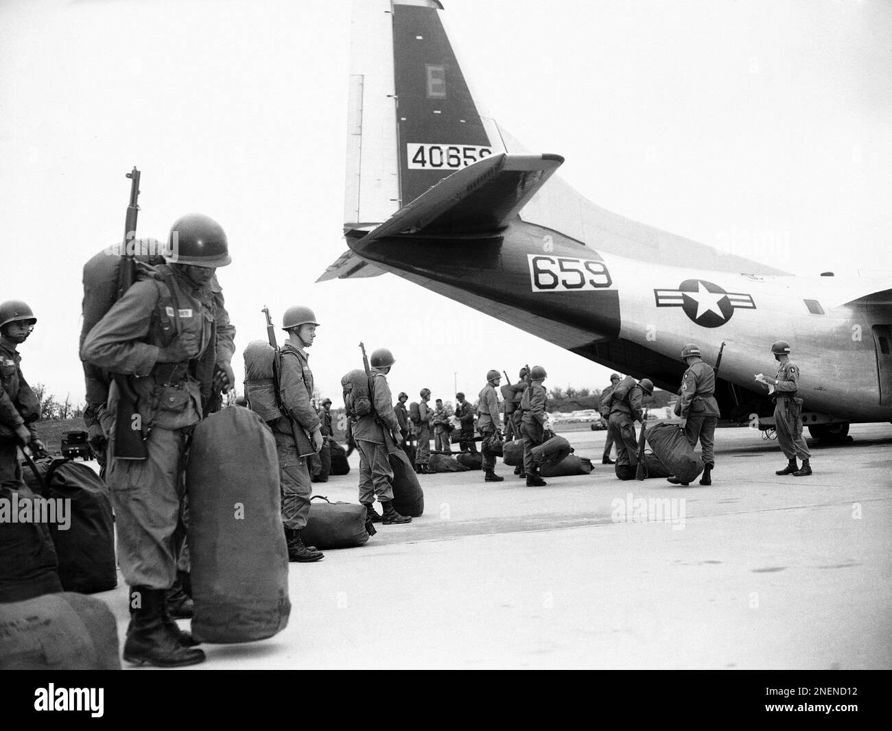 Paratroopers of the 101st Airborne Division, stand by with their gear ...