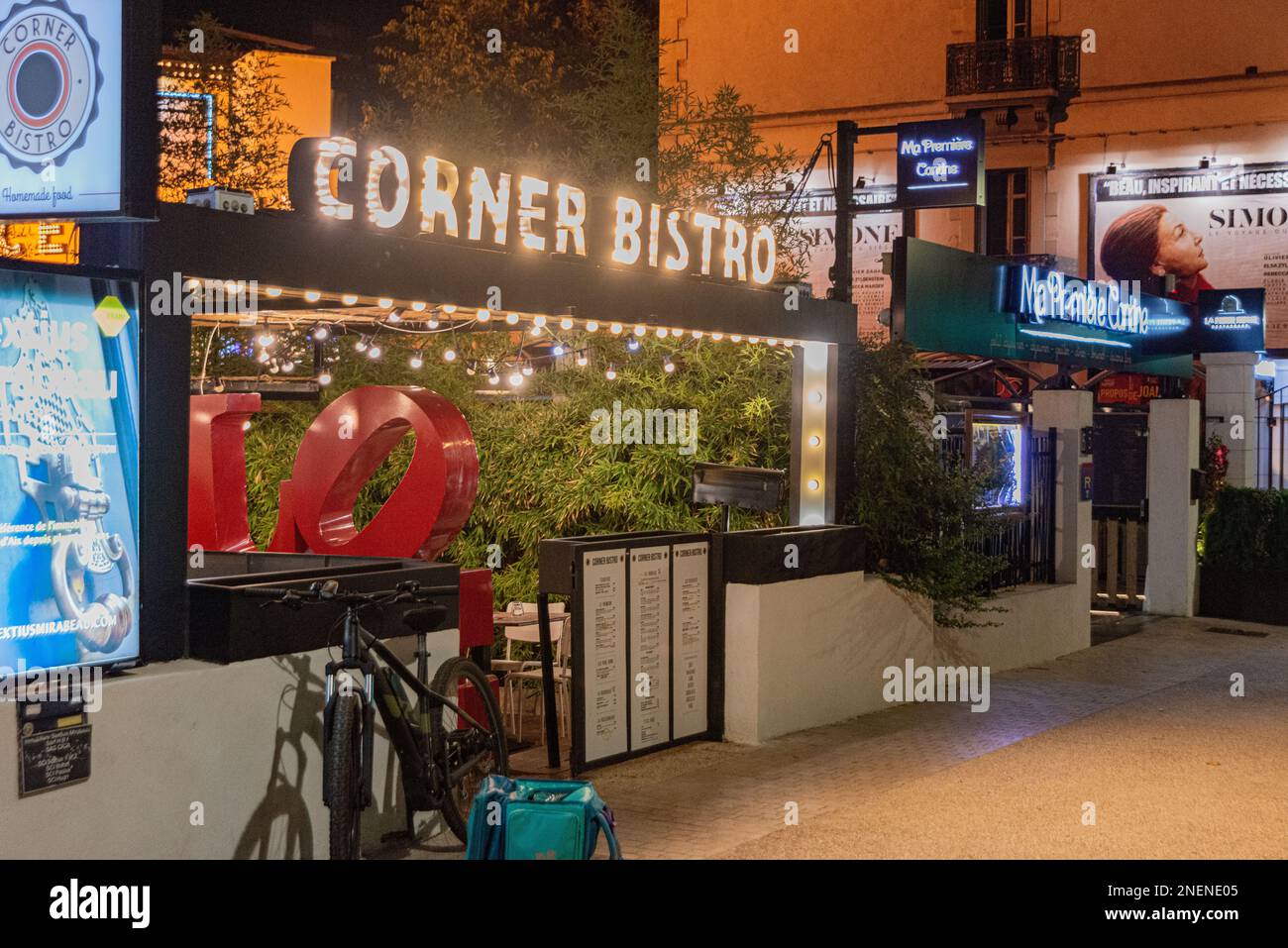 Corner Bistro in Aux-in-Provence, France at night Stock Photo - Alamy