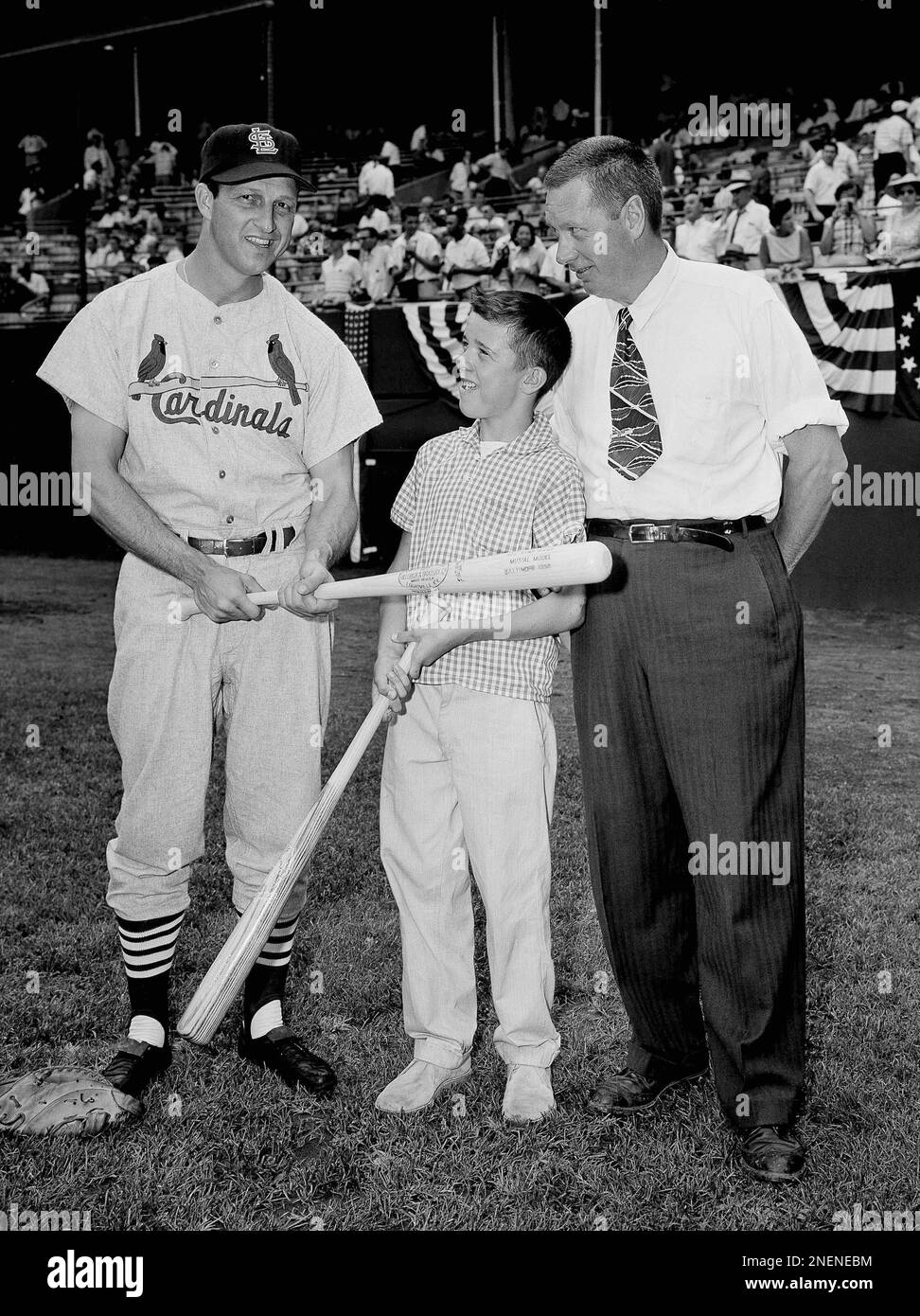 Stan Musial of the St. Louis Cardinals shows his batting grip to Hiram ...