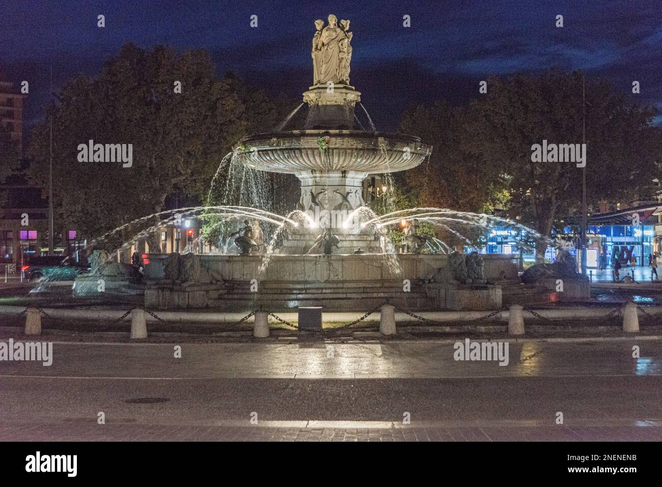 Fountain at Place de La Rotonde in Aux-in-Provence at night Stock Photo ...