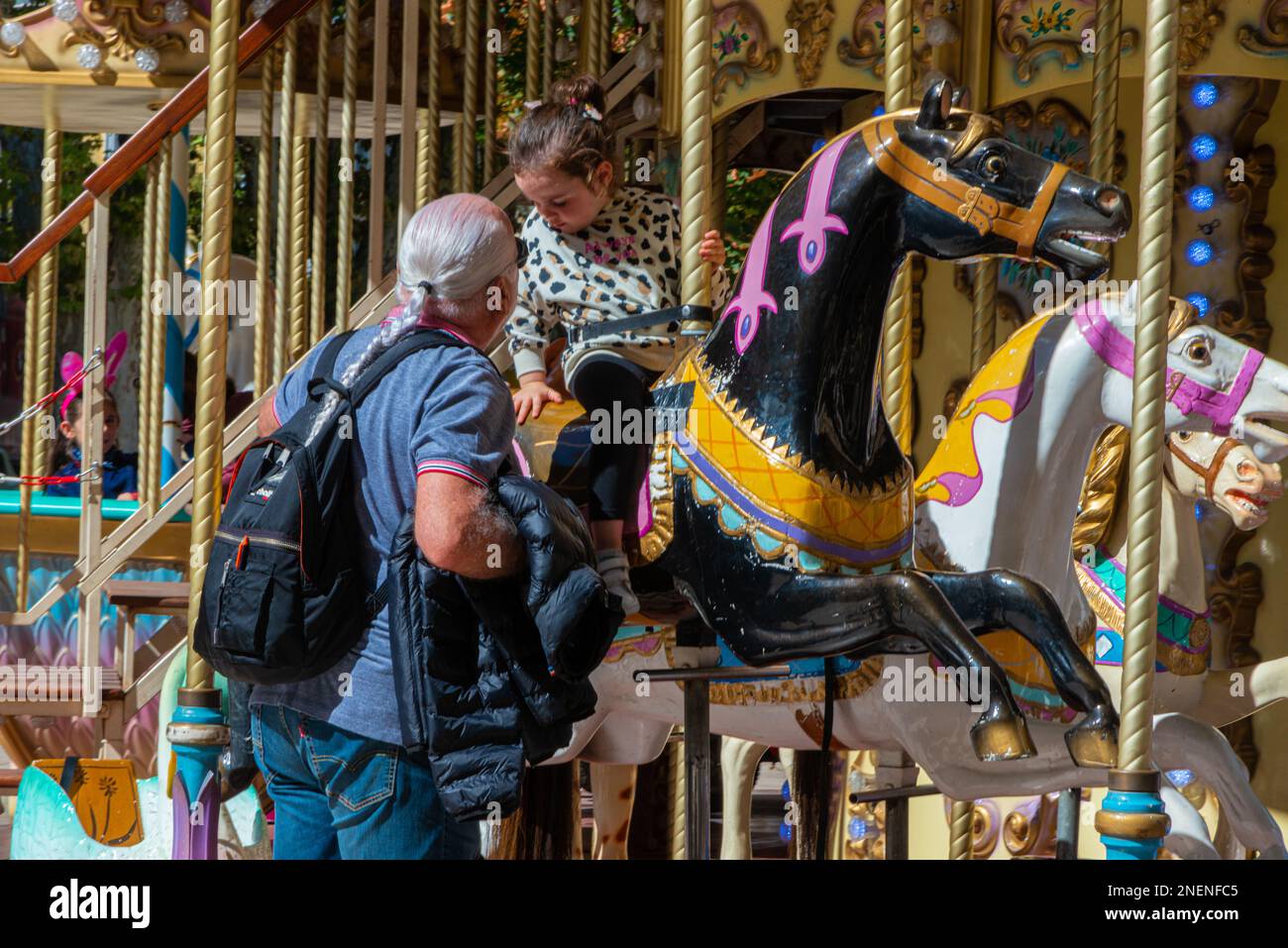 Nervous child on carousel horse hi-res stock photography and images - Alamy