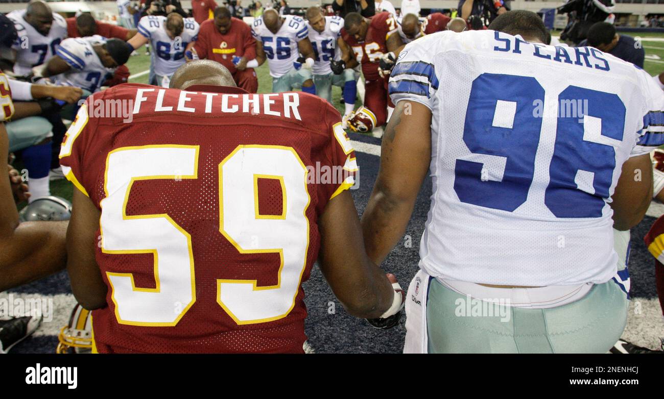 Washington Redskins and Dallas Cowboys player pray after an NFL ...