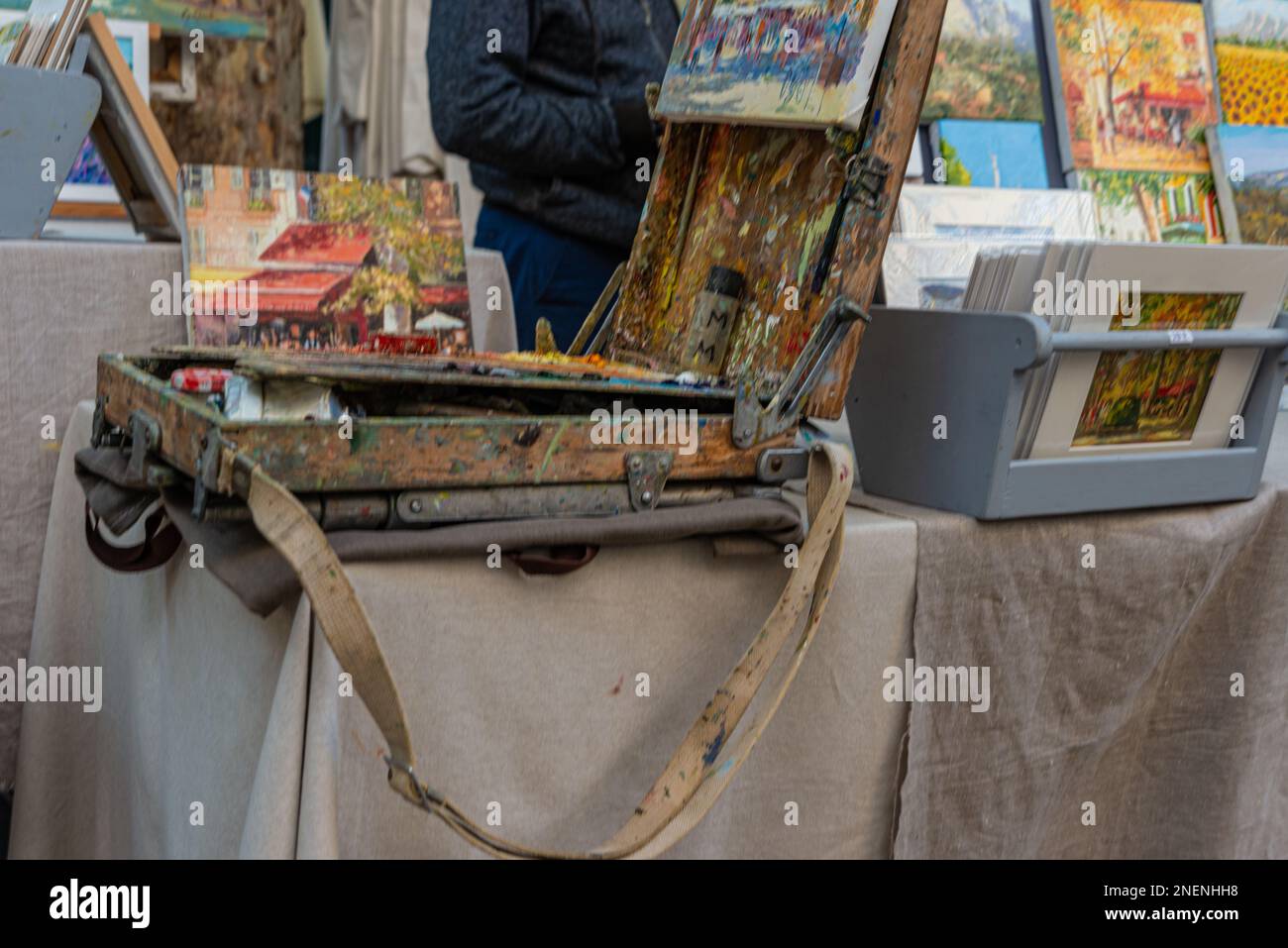 Street artist easel and artwork on display at outdoor street fair Stock ...