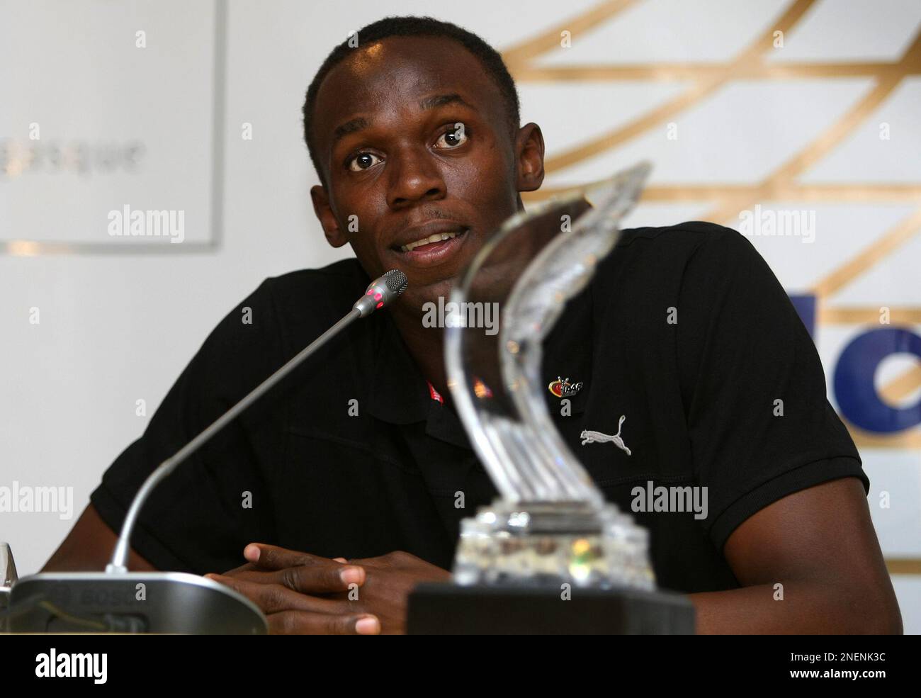 Jamaican sprinter, Usain Bolt is seen with his "Athlete of the Year ...