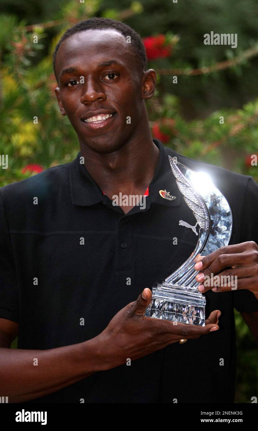 Jamaican sprinter Usain Bolt poses with his "Athlete of the Year Award ...