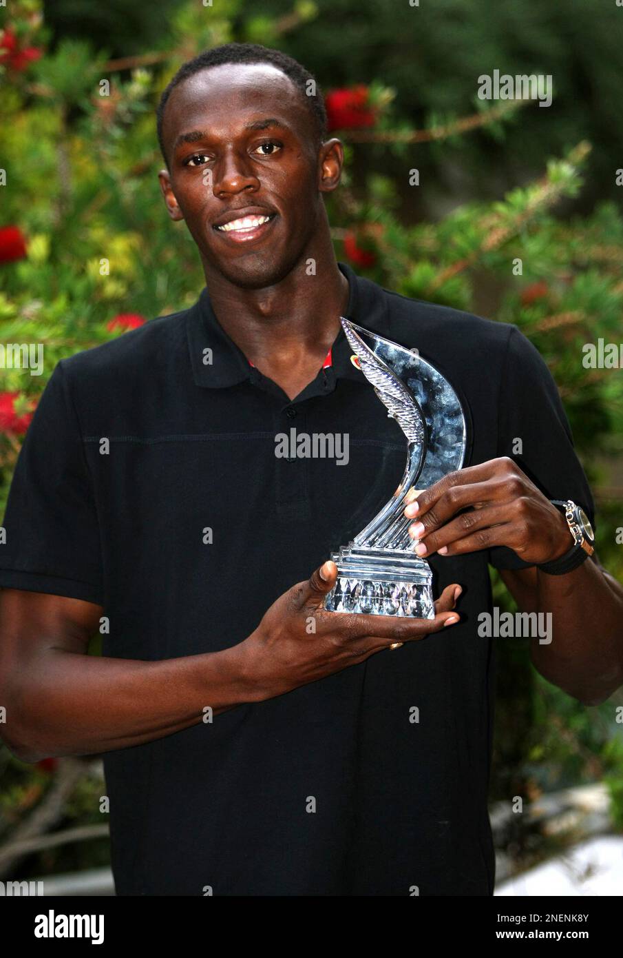 Jamaican sprinter Usain Bolt poses with his "Athlete of the Year Award ...