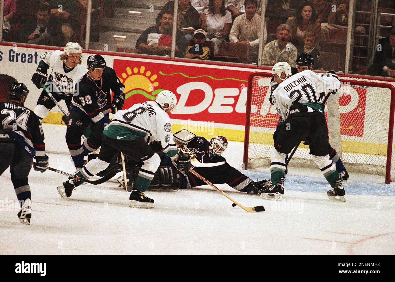 Vancouver Canucks goaltender Tim Keyes keeps the puck out of the ...
