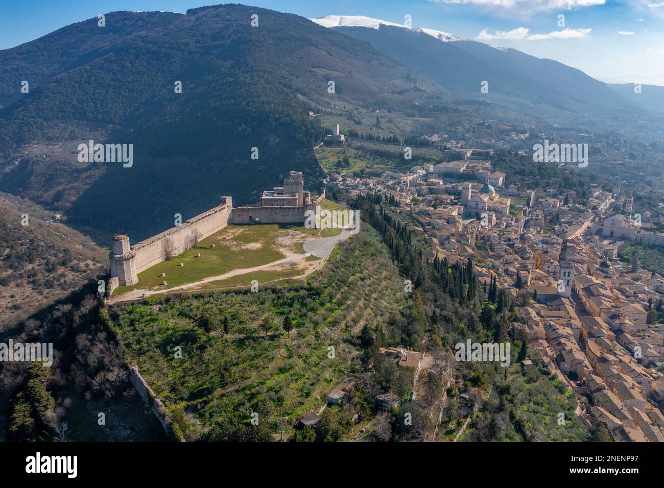 aerial view of the city of assisi umbria with snow covered mount ...