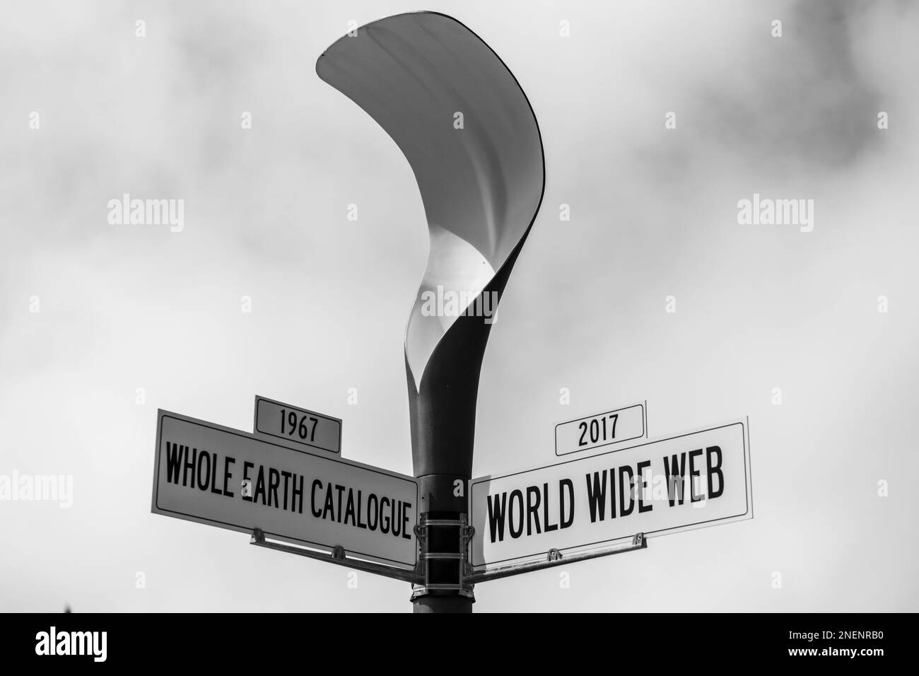 A grayscale of street signs of whole earth catalogue in 1967 and world ...