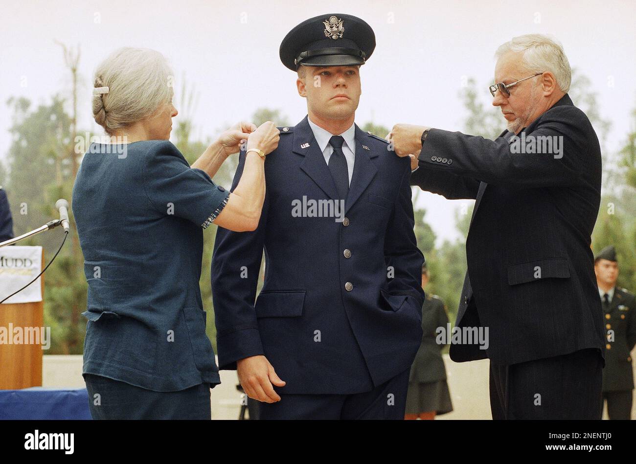 Newly-commissioned Air Force Lt. Steven Grace, center, waits while his ...