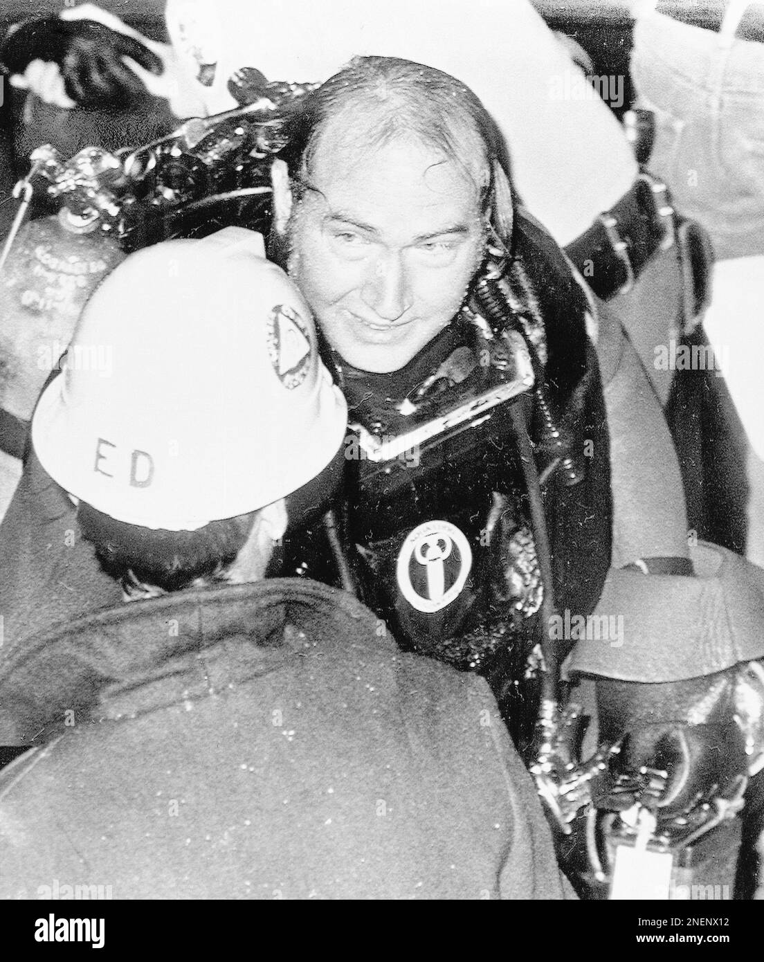 Scuba diver La Bean of Smyrna, Ga., is congratulated after he dived ...