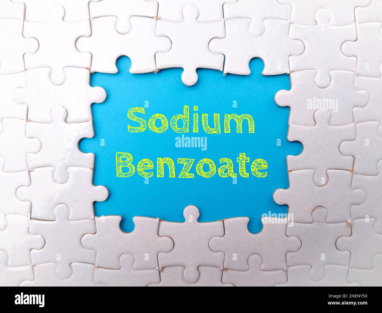 A white puzzle with the word Sodium Benzoate on a blue background Stock ...