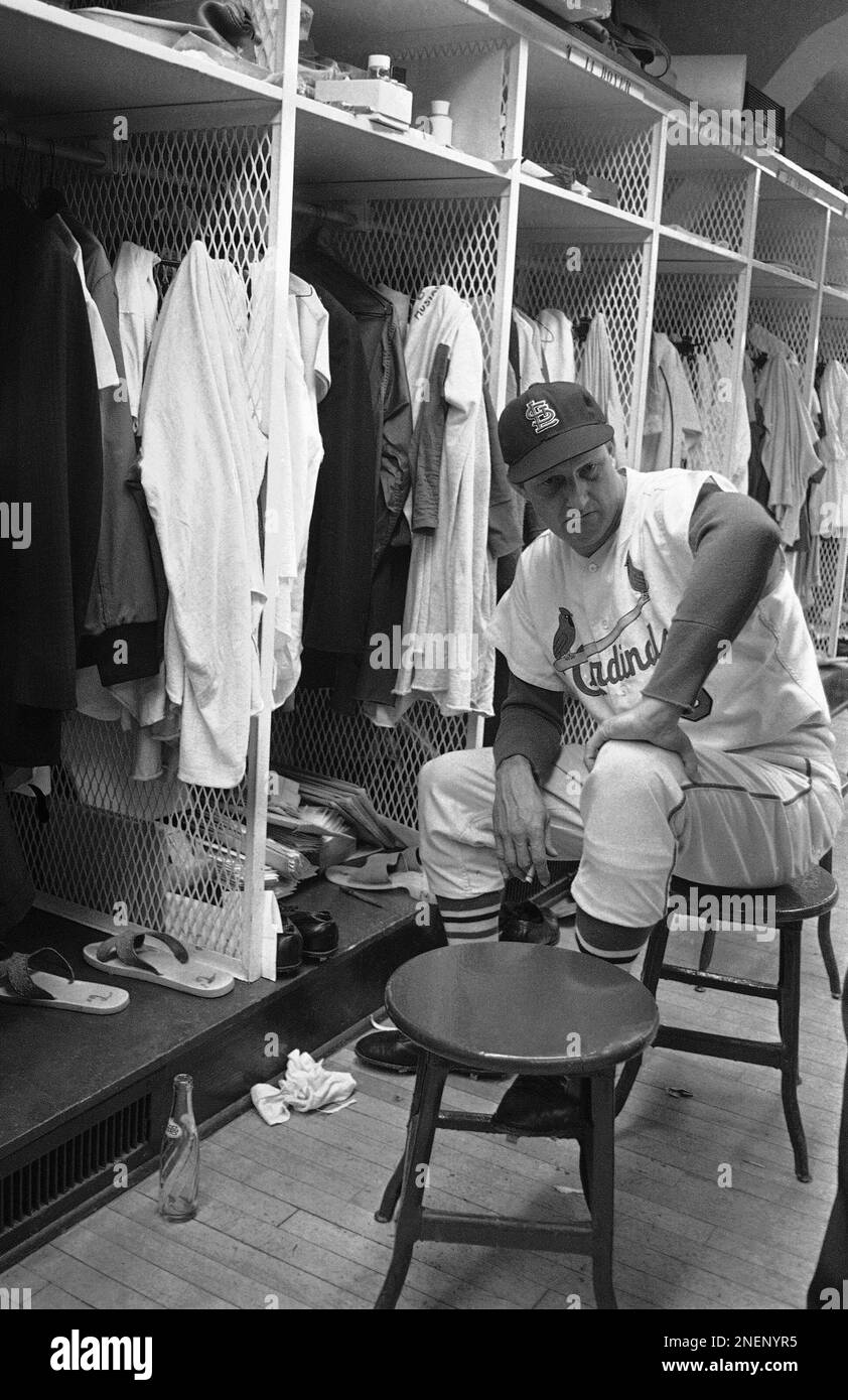 Retiring Stan Musical of St. Louis Cardinals sits in the locker room in ...