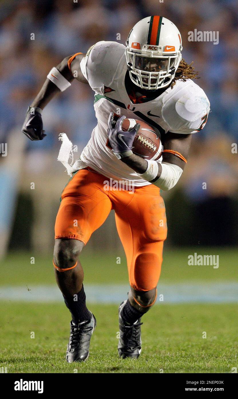 Miami's Graig Cooper runs against North Carolina during the second half ...